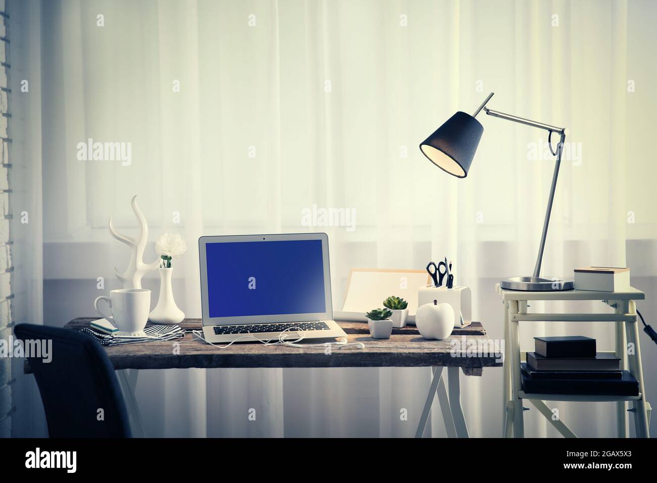 Modern workplace on light background Stock Photo - Alamy