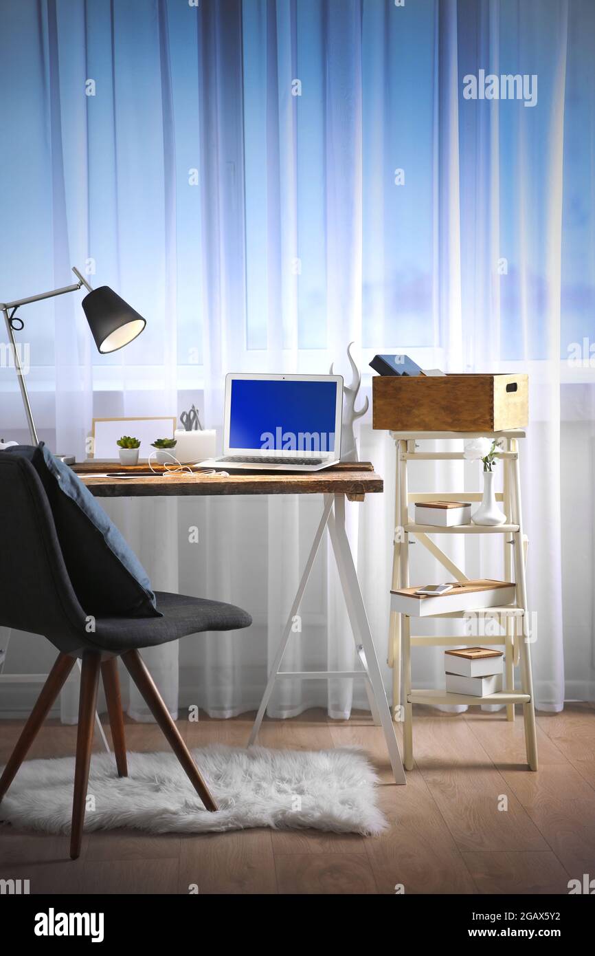 Modern workplace on light background Stock Photo - Alamy