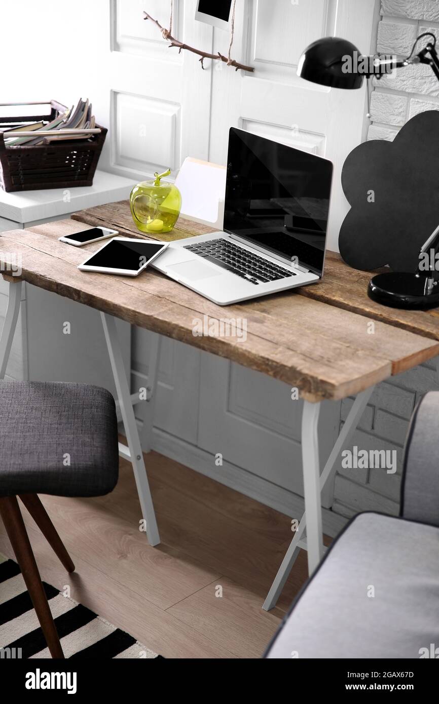 Modern workplace on light background Stock Photo - Alamy