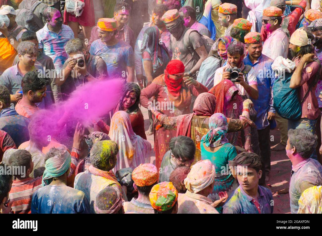 Pilgrims are mingled in colors while celebrating the color festival ...