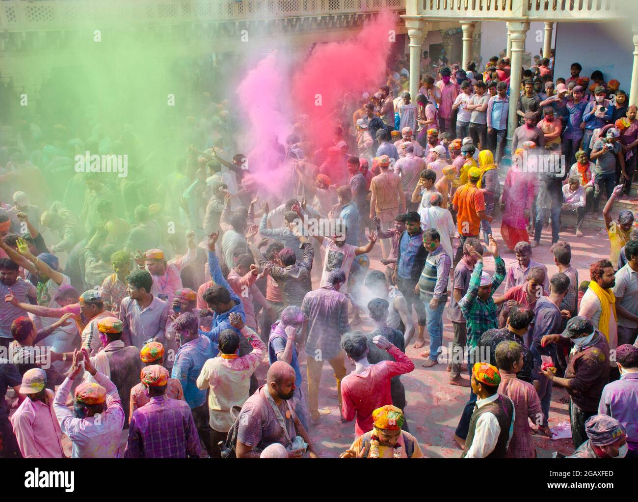 Pilgrims are mingled in colors while celebrating the color festival ...