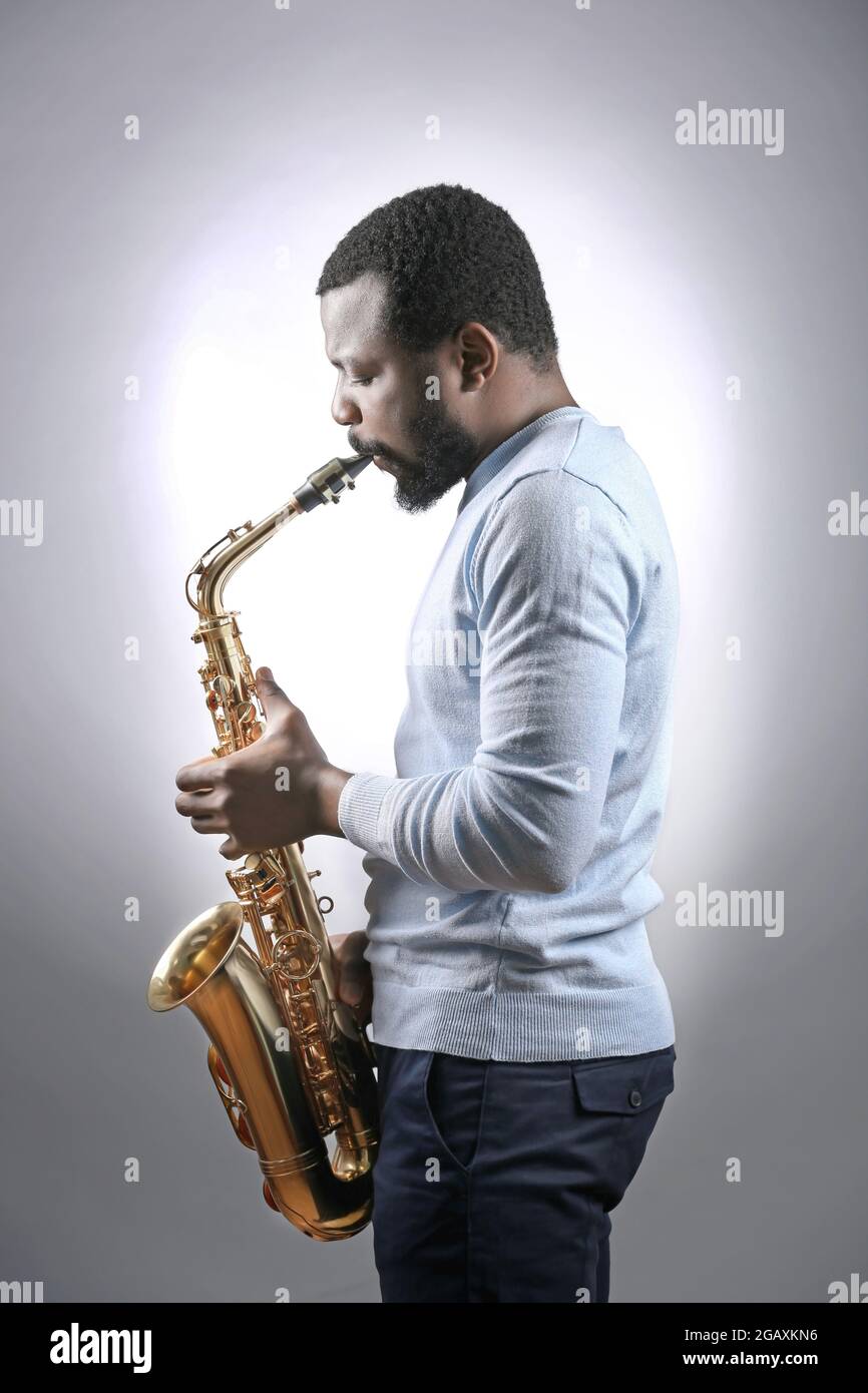 African American jazz musician playing the saxophone Stock Photo - Alamy