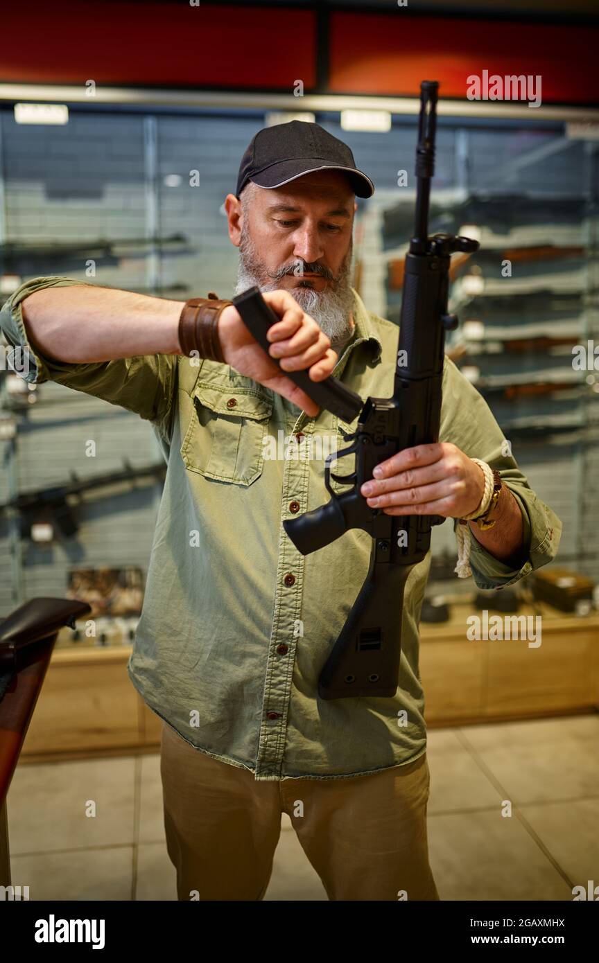 Man loads rifle indoor shooting hi-res stock photography and images - Alamy