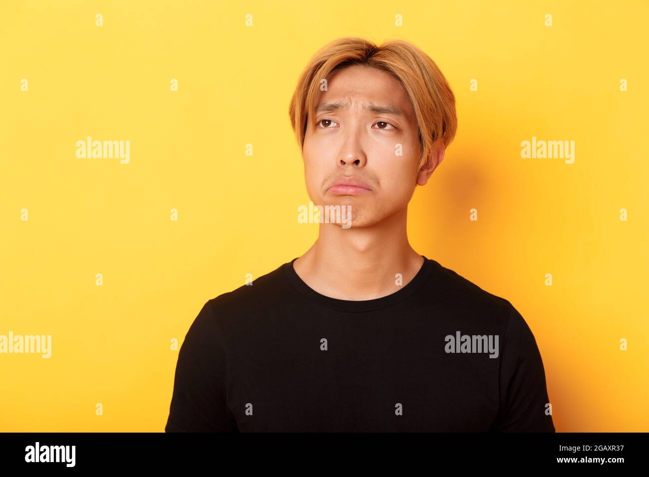 Close-up of sad and disappointed handsome asian guy sulking upset ...