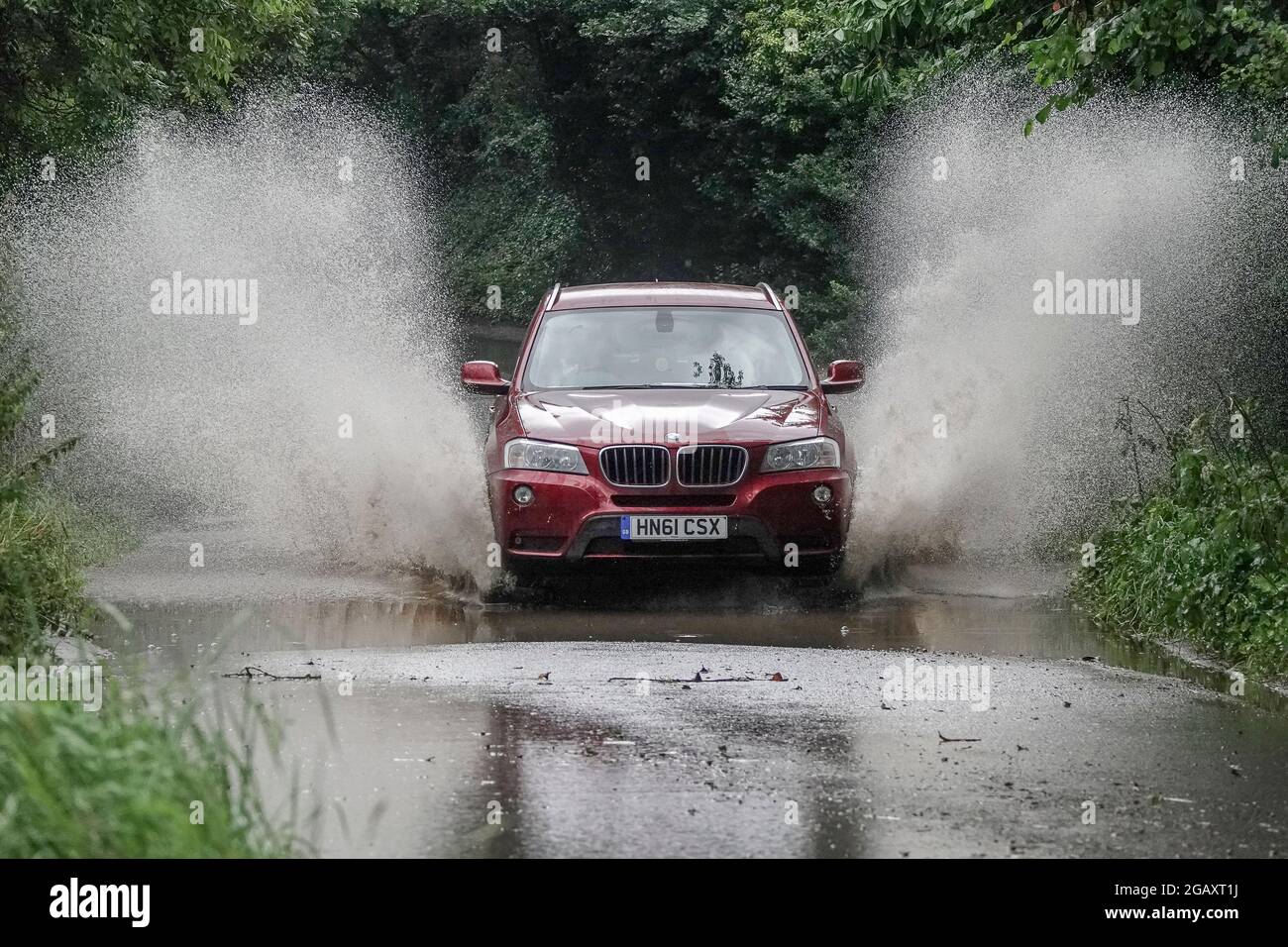 Speeding car in flood hi-res stock photography and images - Alamy