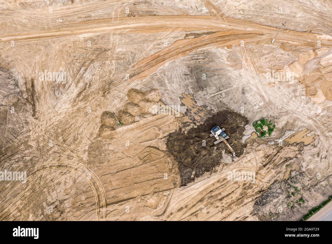 industrial excavator working on construction site. aerial top view from ...