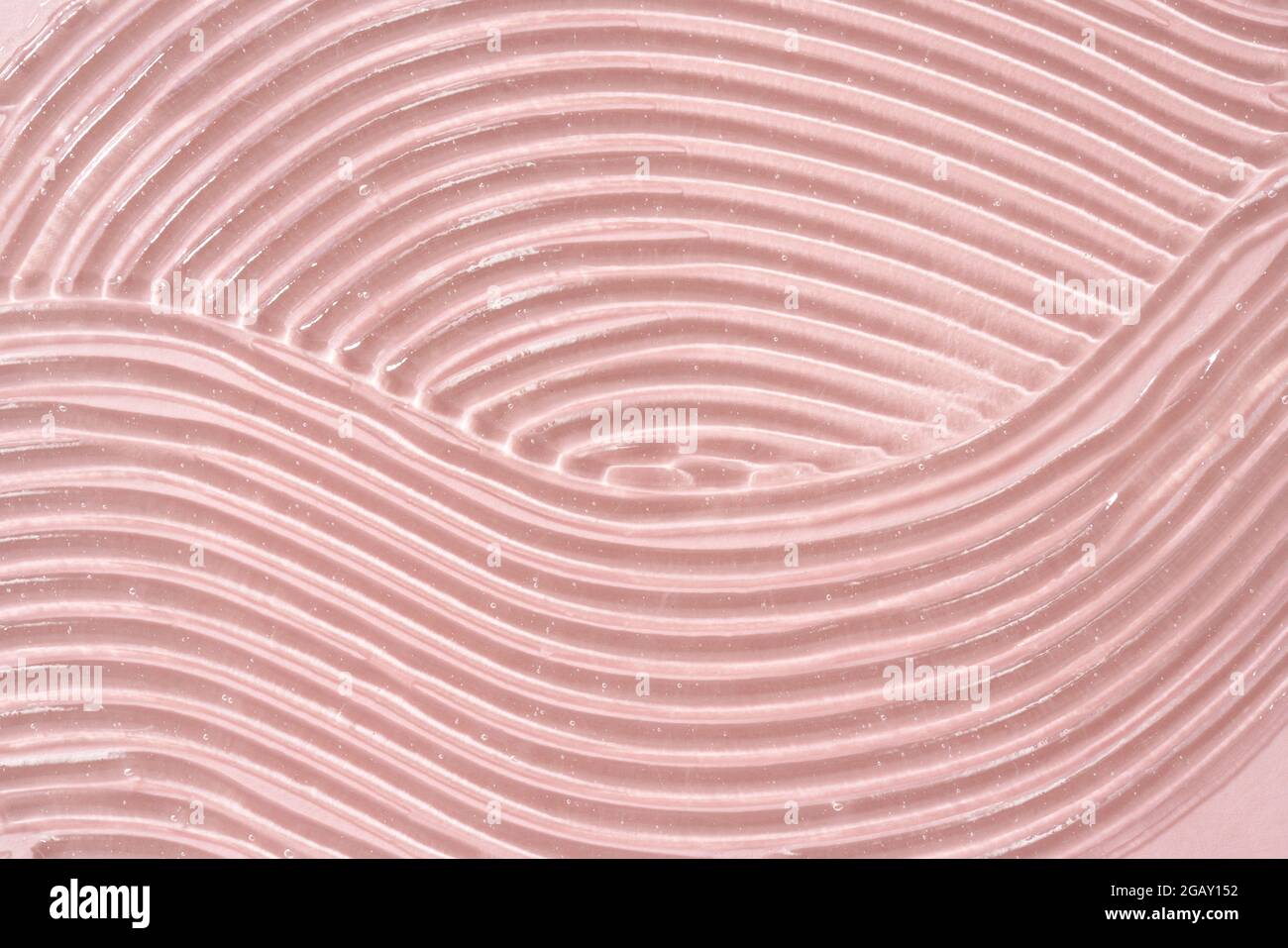 Aloe vera gel spread over pink background. Natural skin moisturizer ...