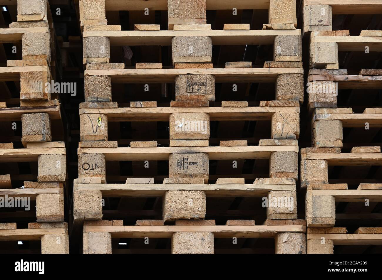 Stack with wooden pallets Stock Photo - Alamy