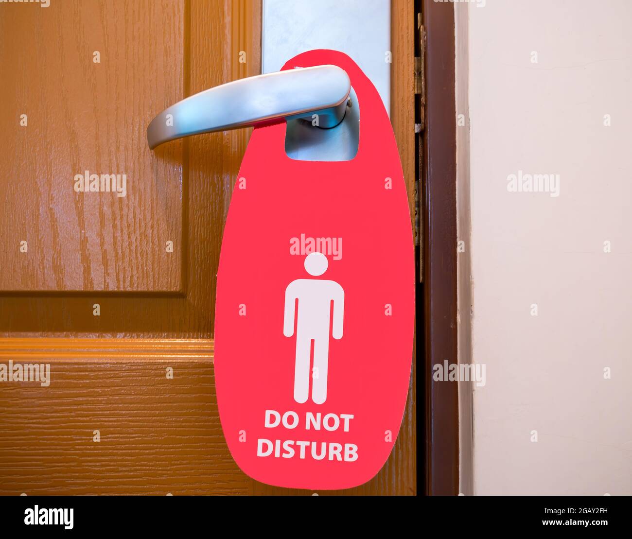 Do not disturb sign hanging on the door handle at a hotel Stock Photo ...