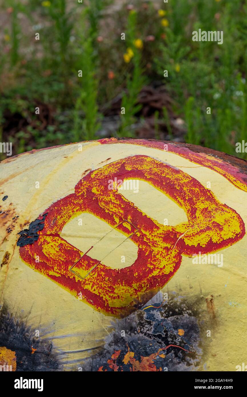 old rusting buoy, marine buoy corroding, old rusty yellow marker buoy ...