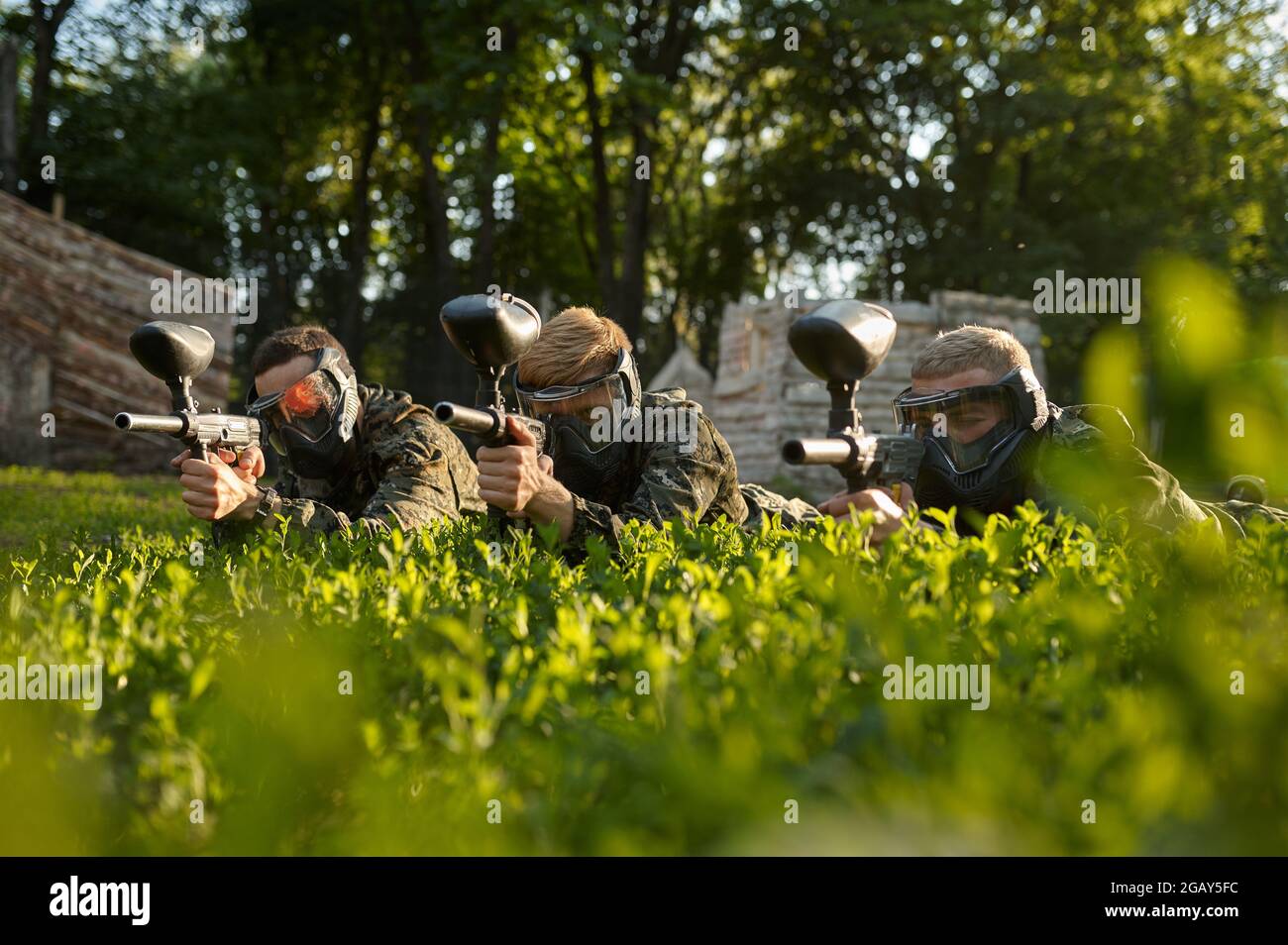 Paintball team, battle on playground in the forest Stock Photo - Alamy