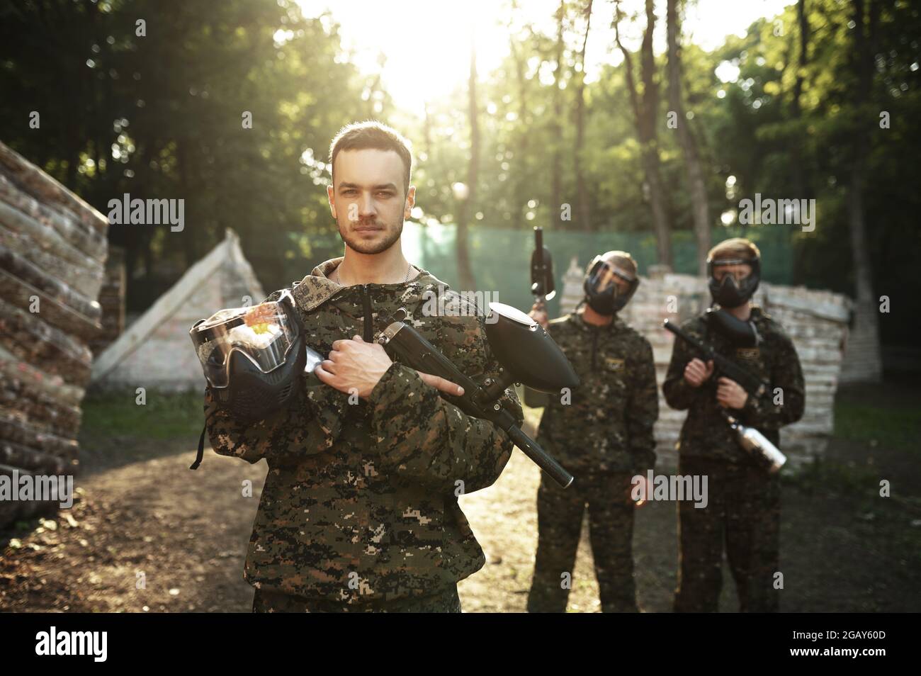 Paintball team, warriors poses on playground Stock Photo - Alamy