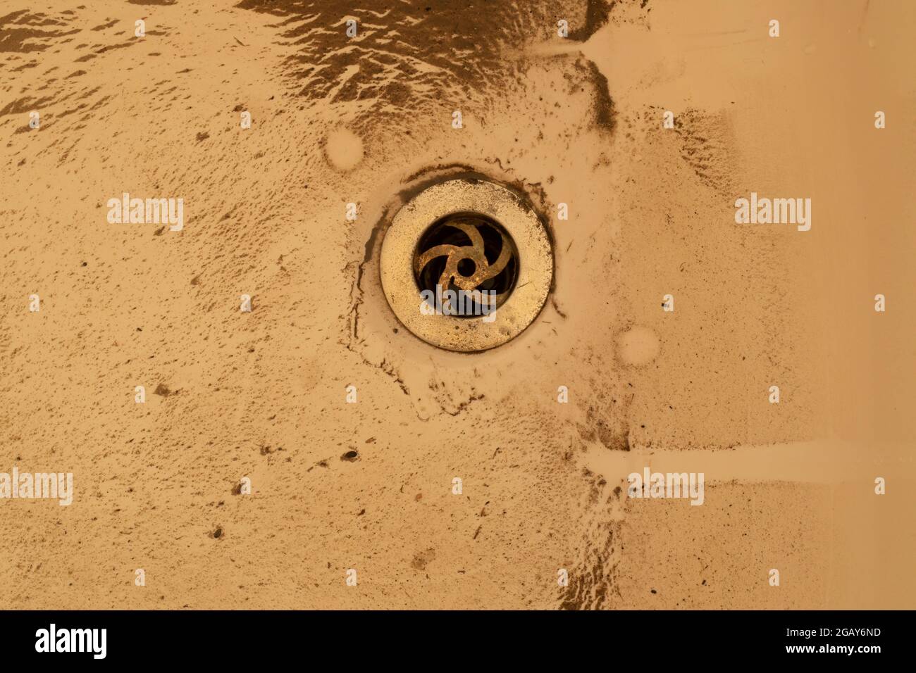 Bath, base, bottom with pattern of dirt, detritus, sand, grit leaving ...