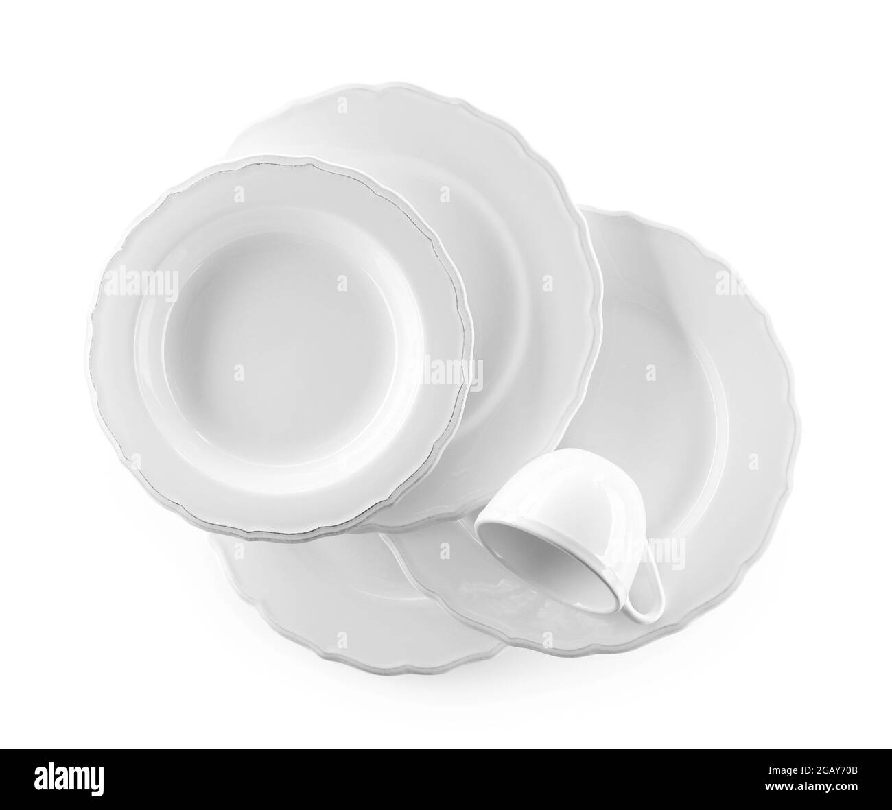 Stack of plates with cup, isolated on white Stock Photo - Alamy
