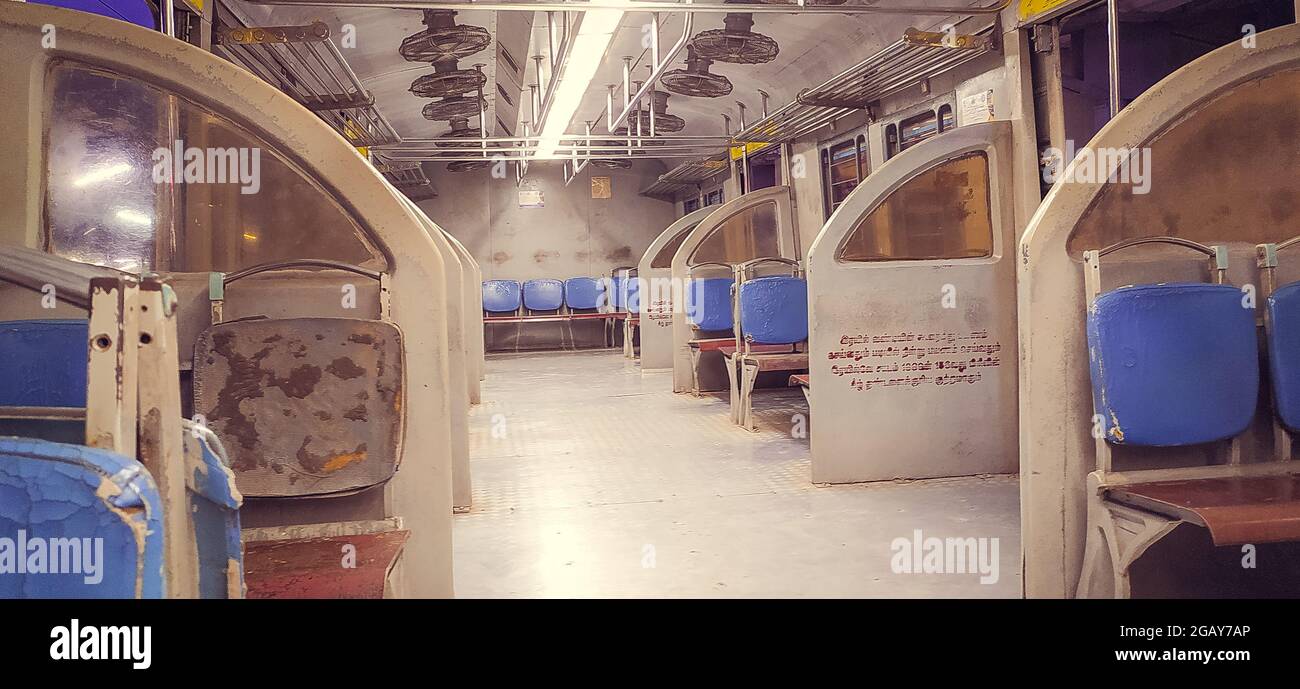 interior of Suburban local train on the railway station. City metro ...