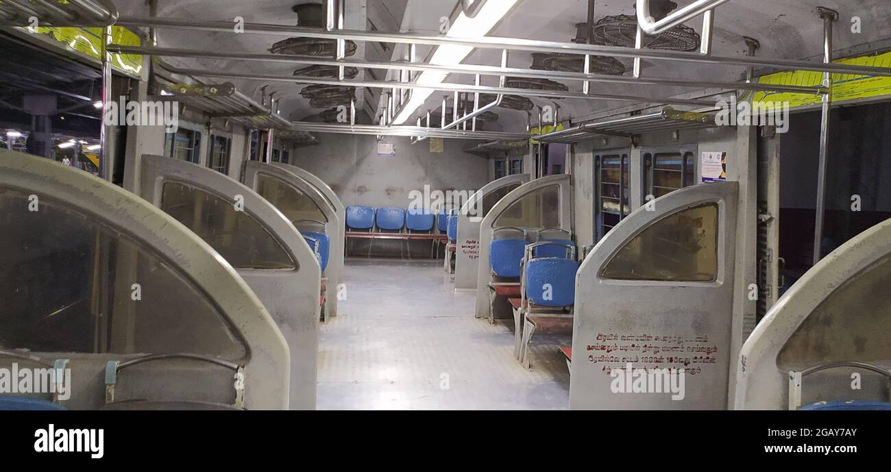 interior of Suburban local train on the railway station. City metro ...
