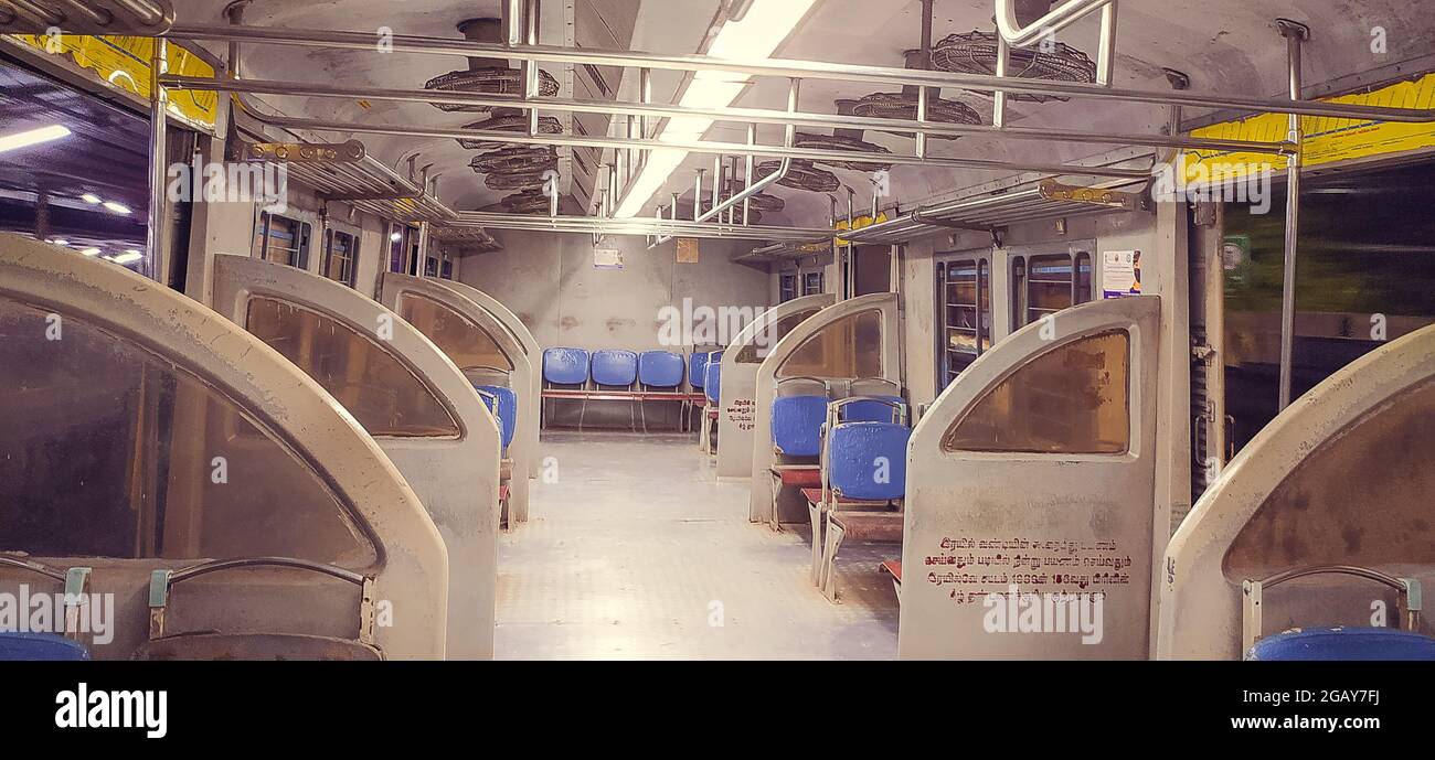 interior of Suburban local train on the railway station. City metro ...