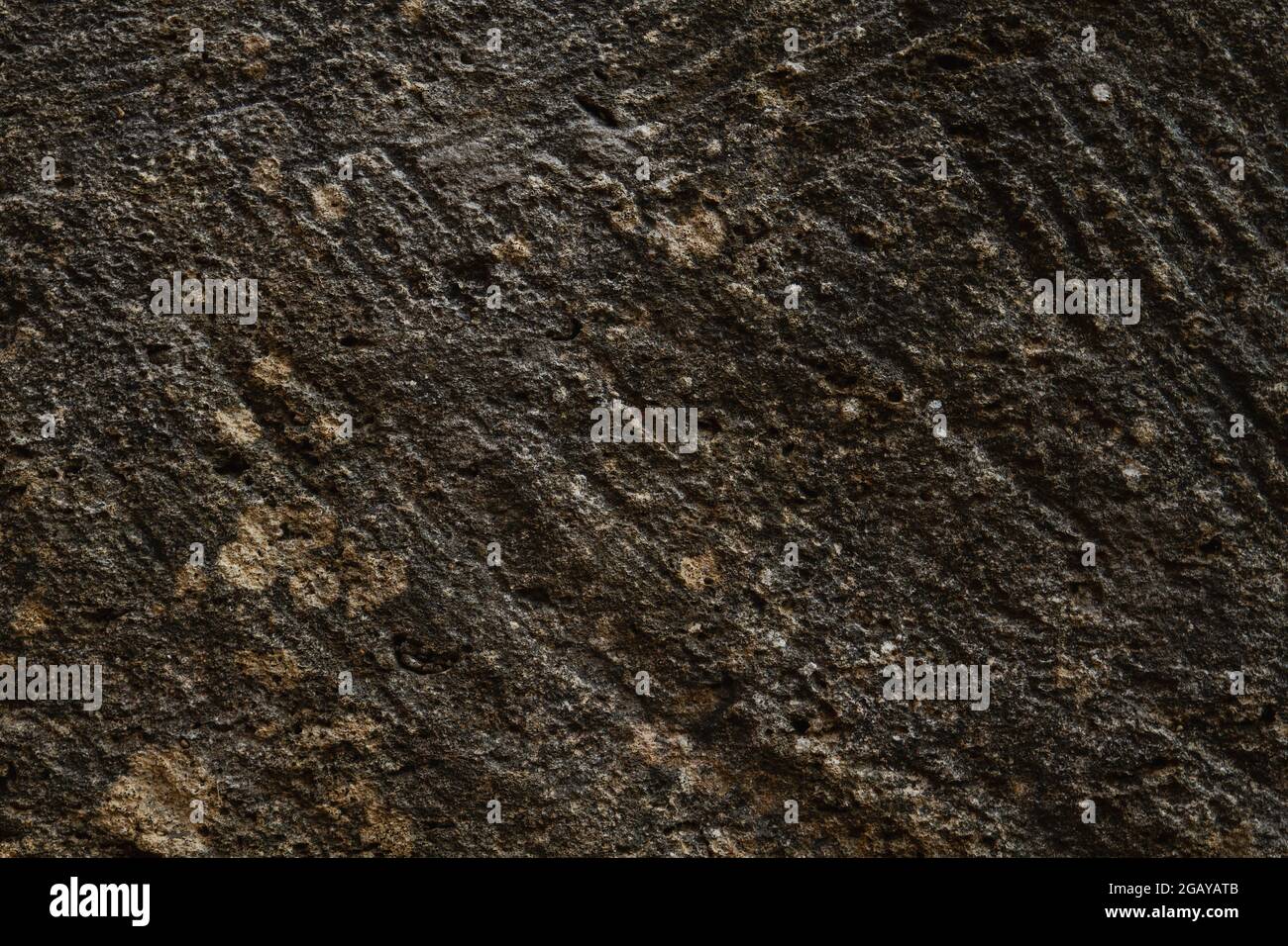 Detail of rough and porous dark sandstone wall texture Stock Photo - Alamy