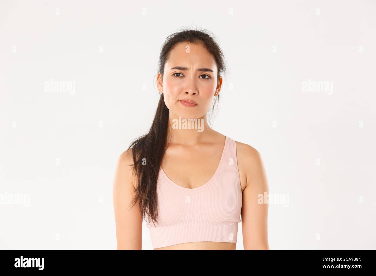 Sport, wellbeing and active lifestyle concept. Skeptical and displeased ...