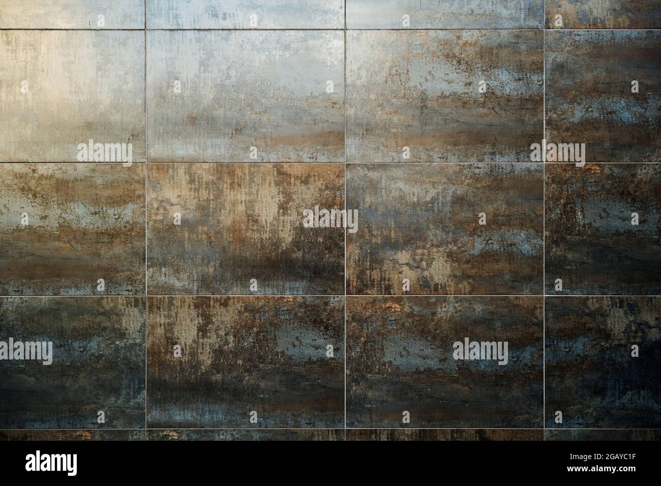 Modern distressed tiled wall with oxidized effect and grunge texture ...
