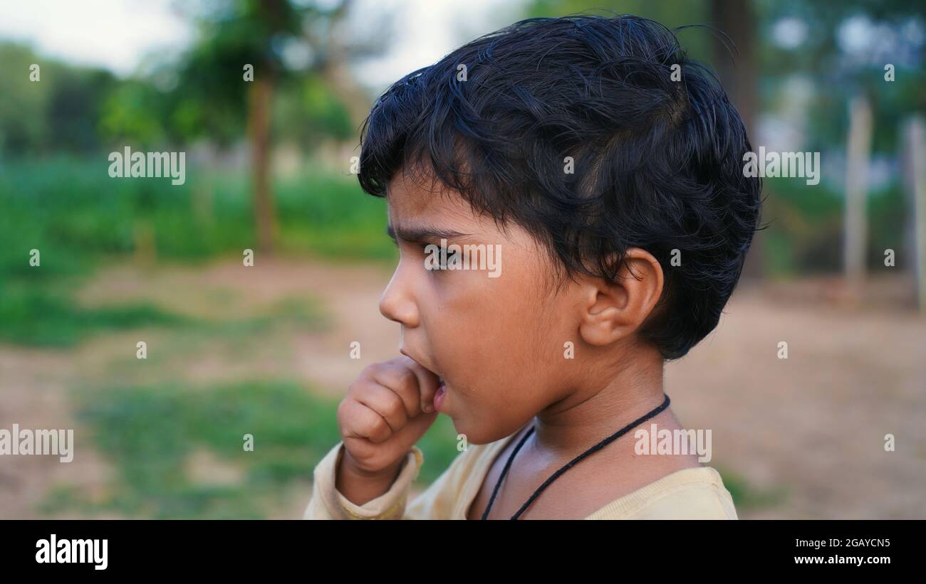 Cute Indian angel relaxing in natural background Stock Photo - Alamy