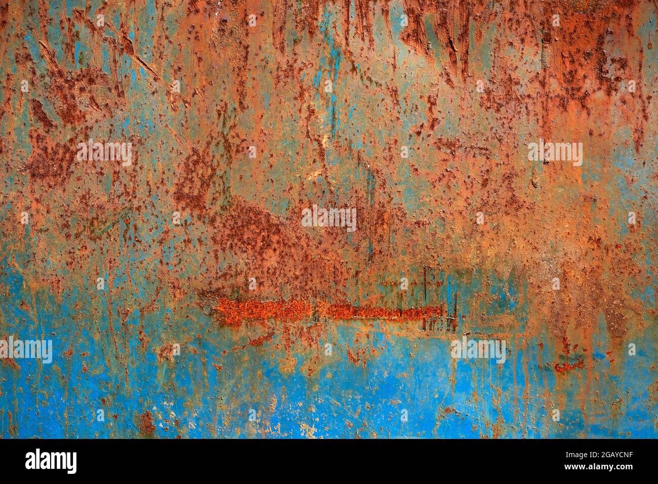 Old rusty metal sheet with blue peeling paint grunge background or ...