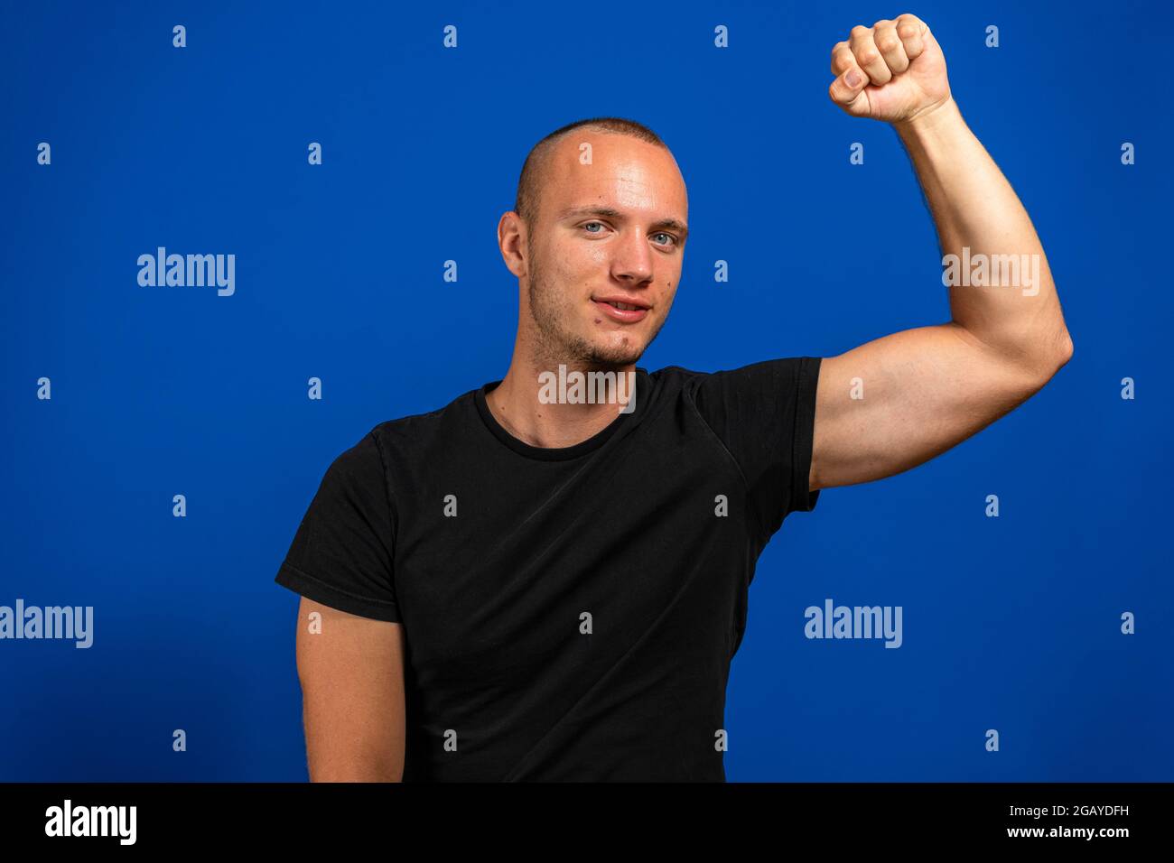 Photo of happy victorious young man raise hand celebrate raise fist ...