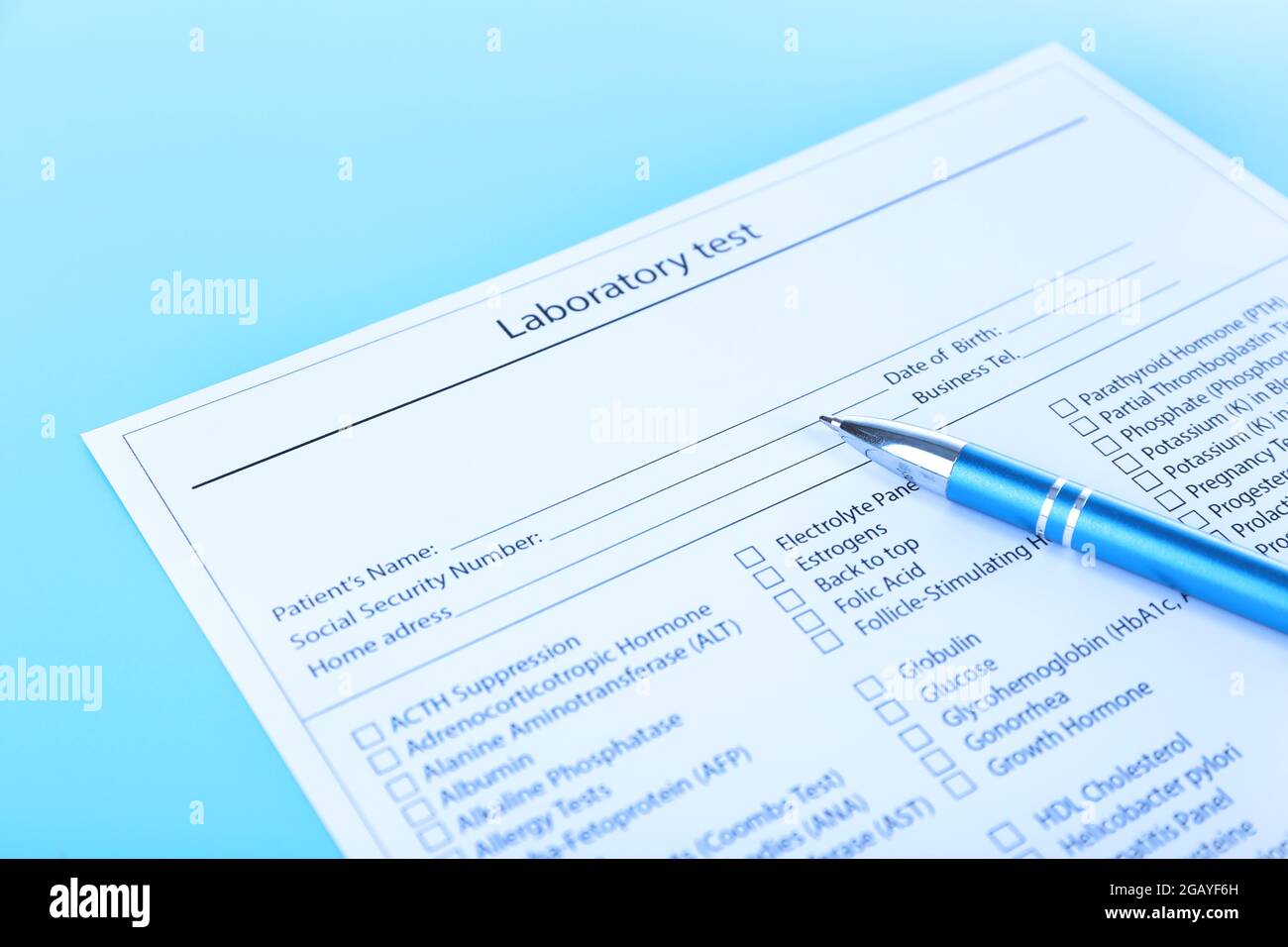 Laboratory test list with pen on blue background, close up Stock Photo ...
