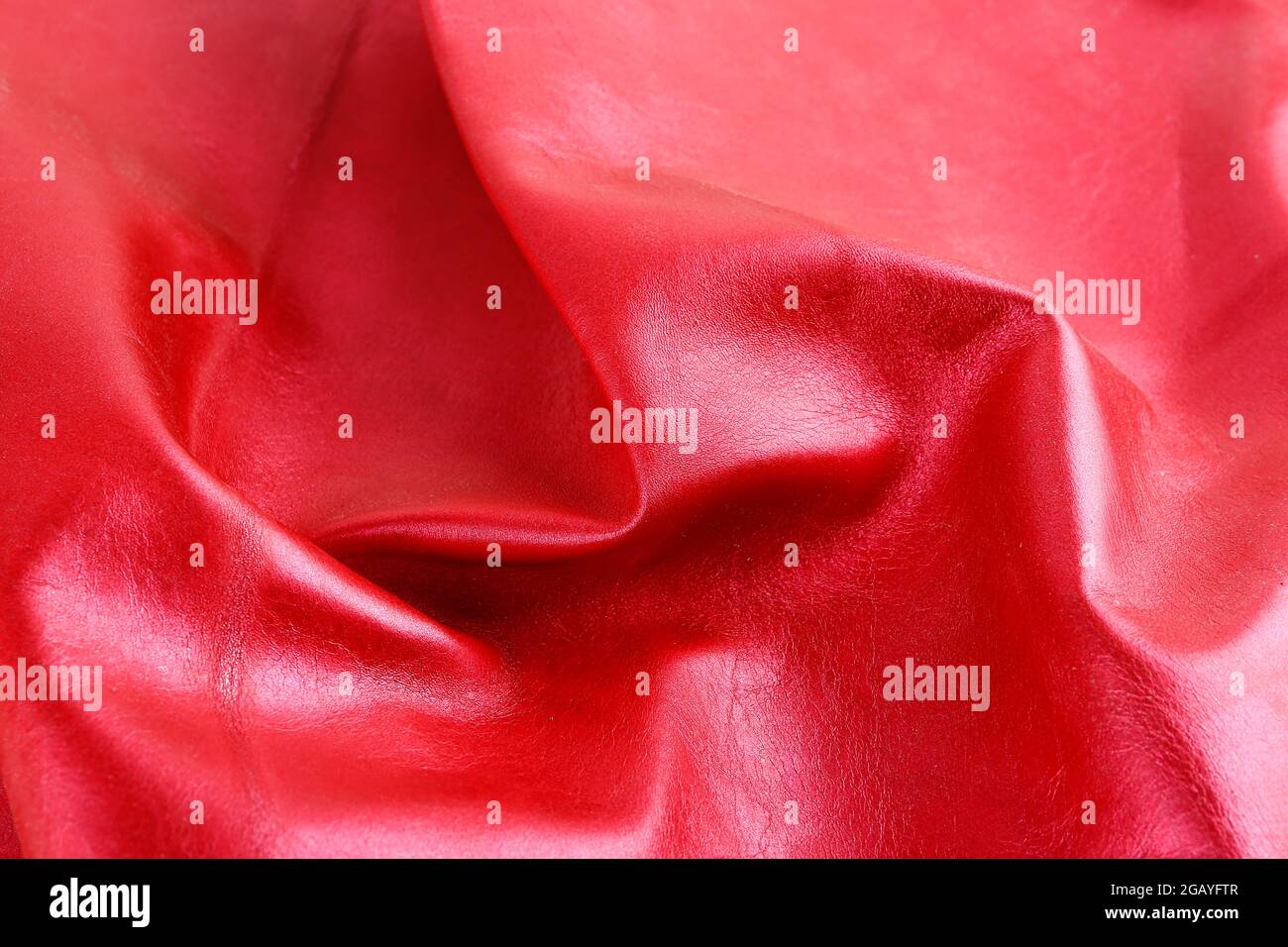 Red shiny leather texture close up Stock Photo - Alamy