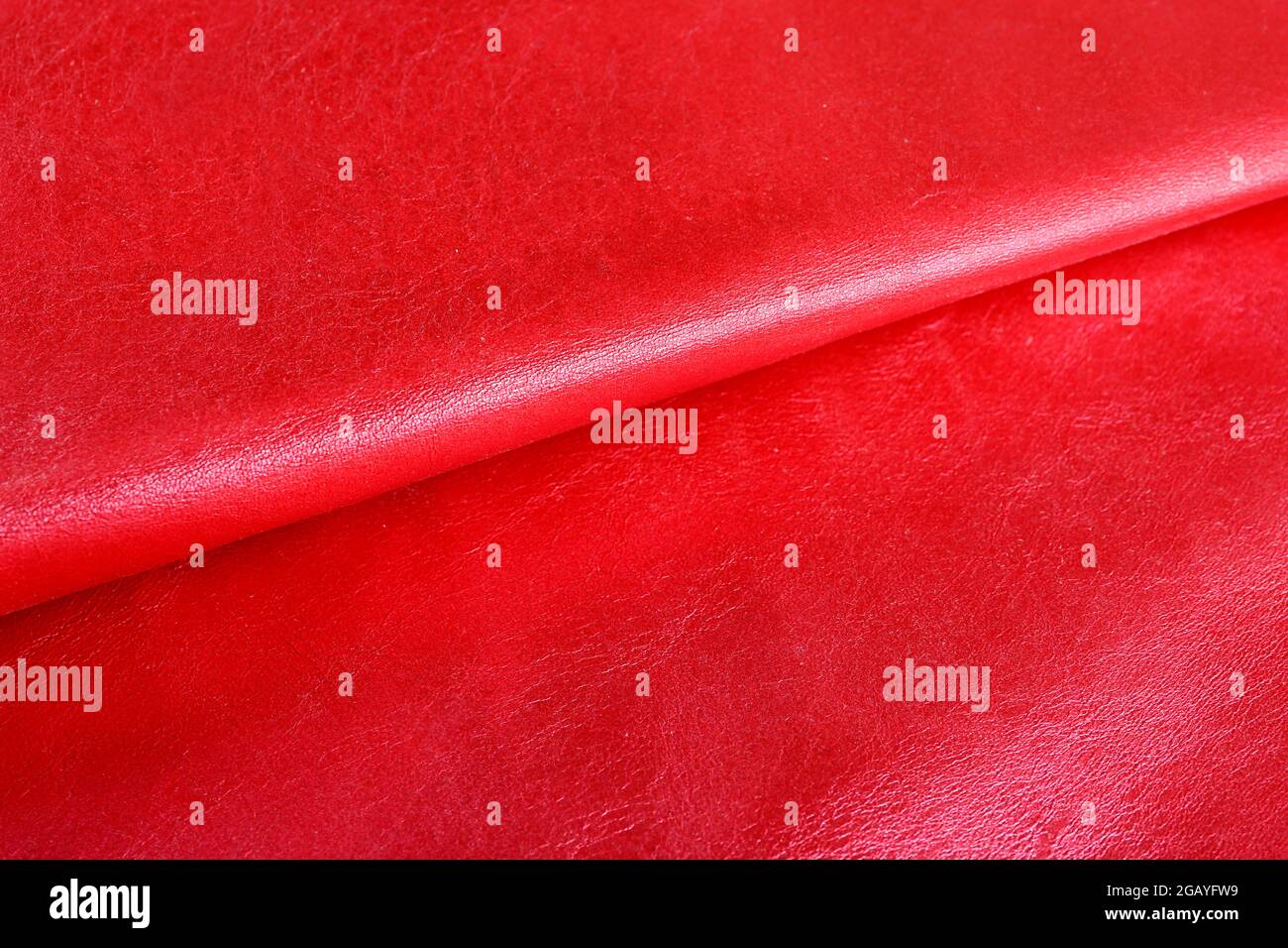 Red shiny leather texture close up Stock Photo - Alamy