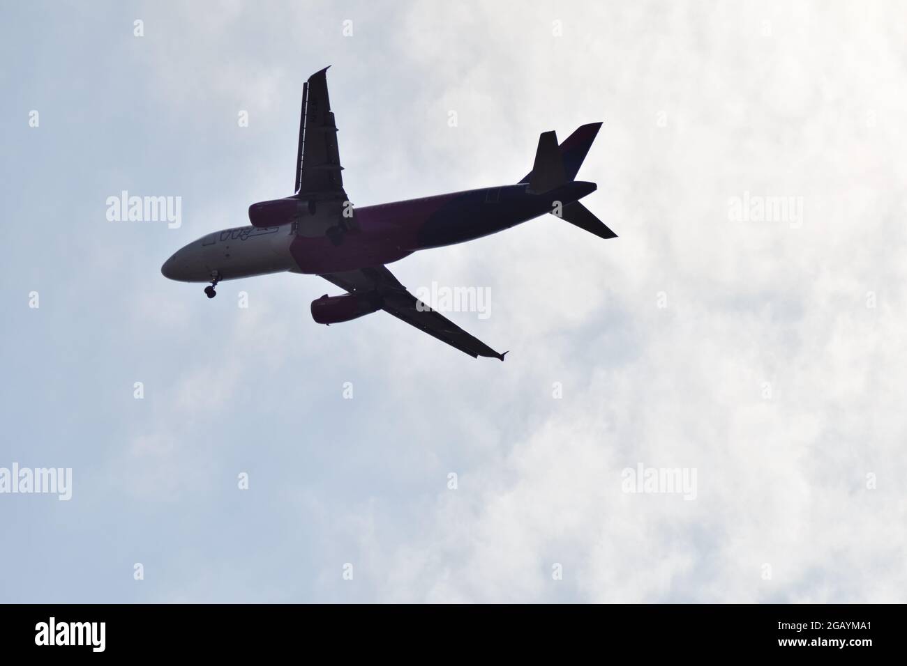 Airbus A320 flying above preparing for landing Stock Photo - Alamy