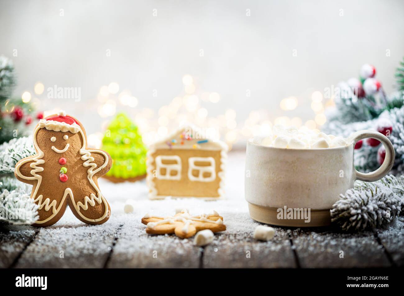 Christmas decorations on snow with cup of hot chocolate, gingerbread ...