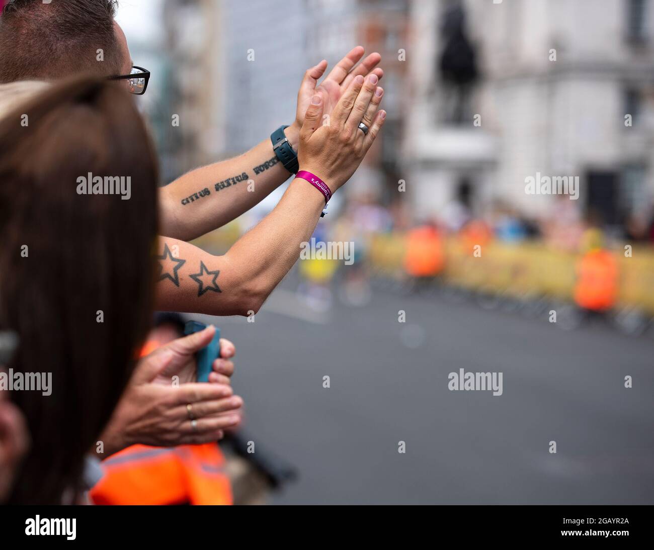 Fans cheering on the runners near the finish line during the 2021 ...