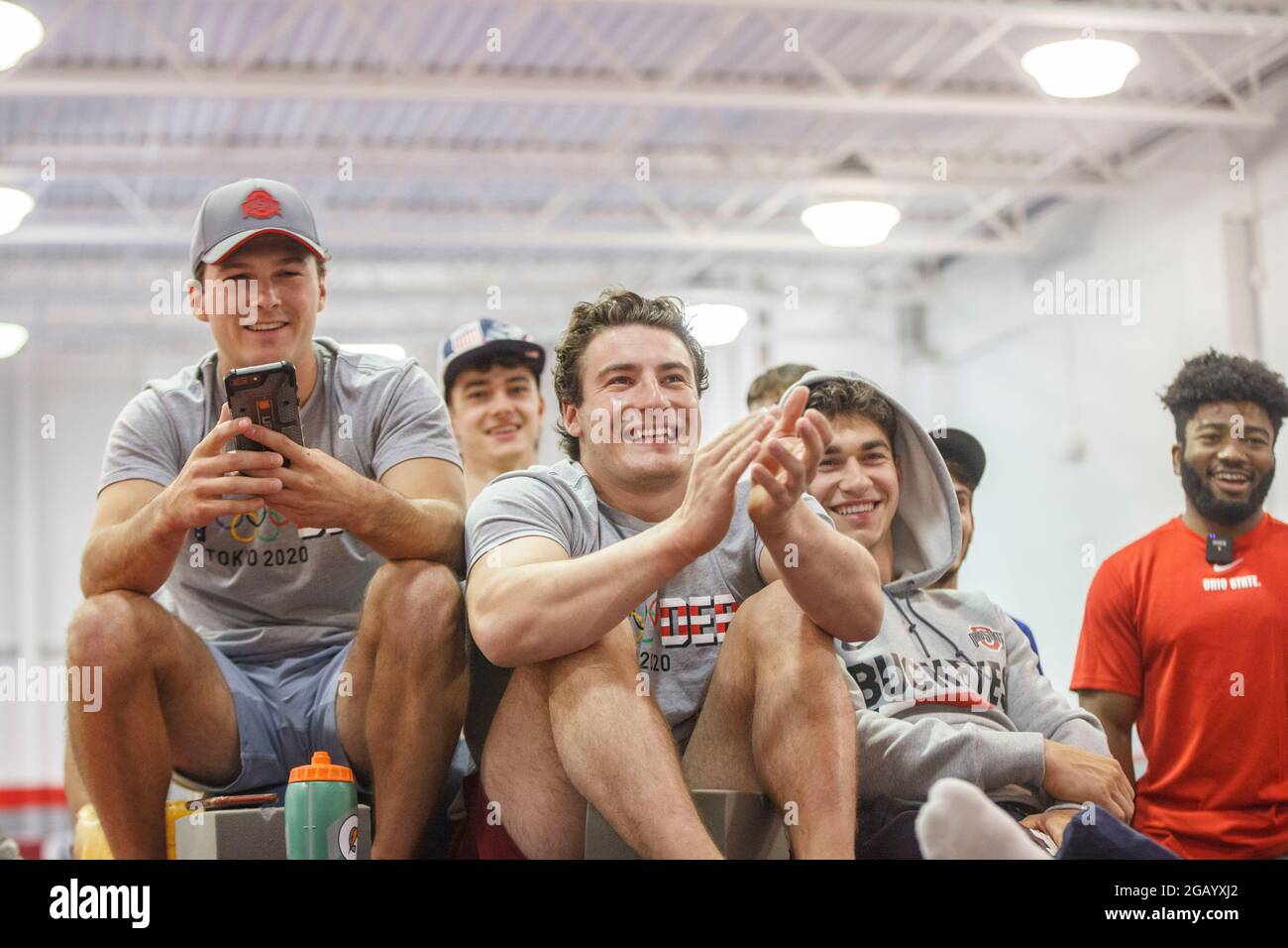 Men’s Gymnastics team reacts as they watch the Men’s Pommel Horse ...