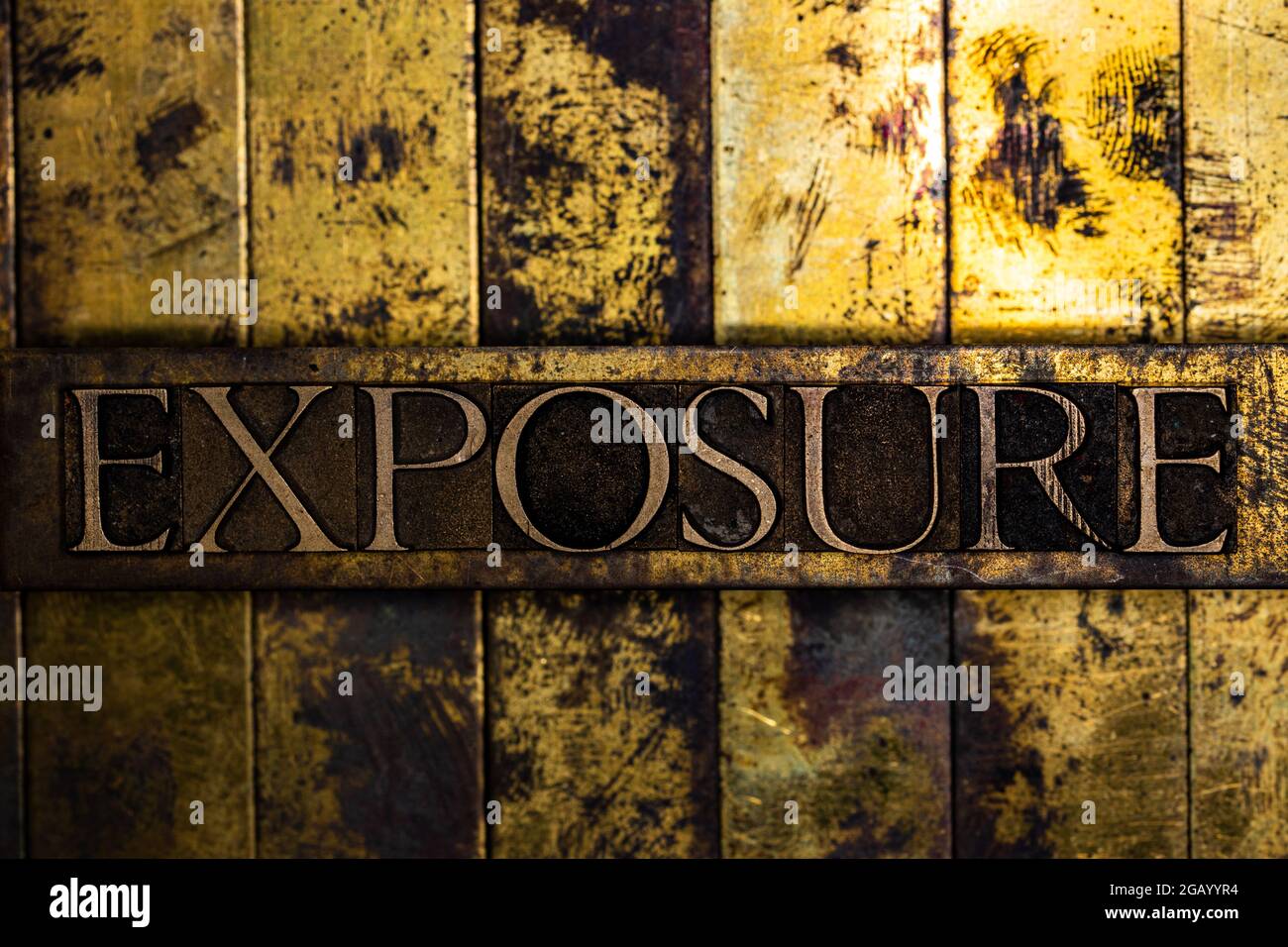 Exposure text message on vintage textured grunge copper and gold ...