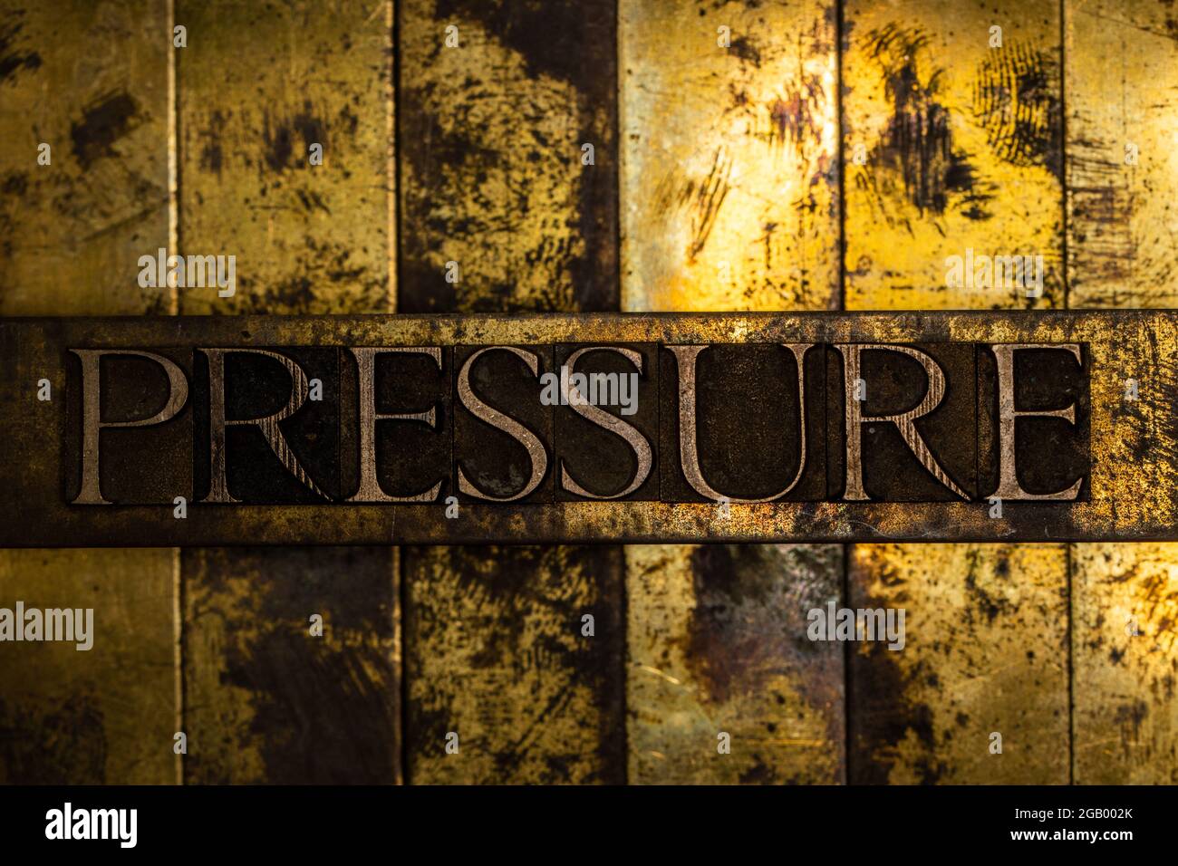 Pressure text on vintage textured copper and gold background Stock ...