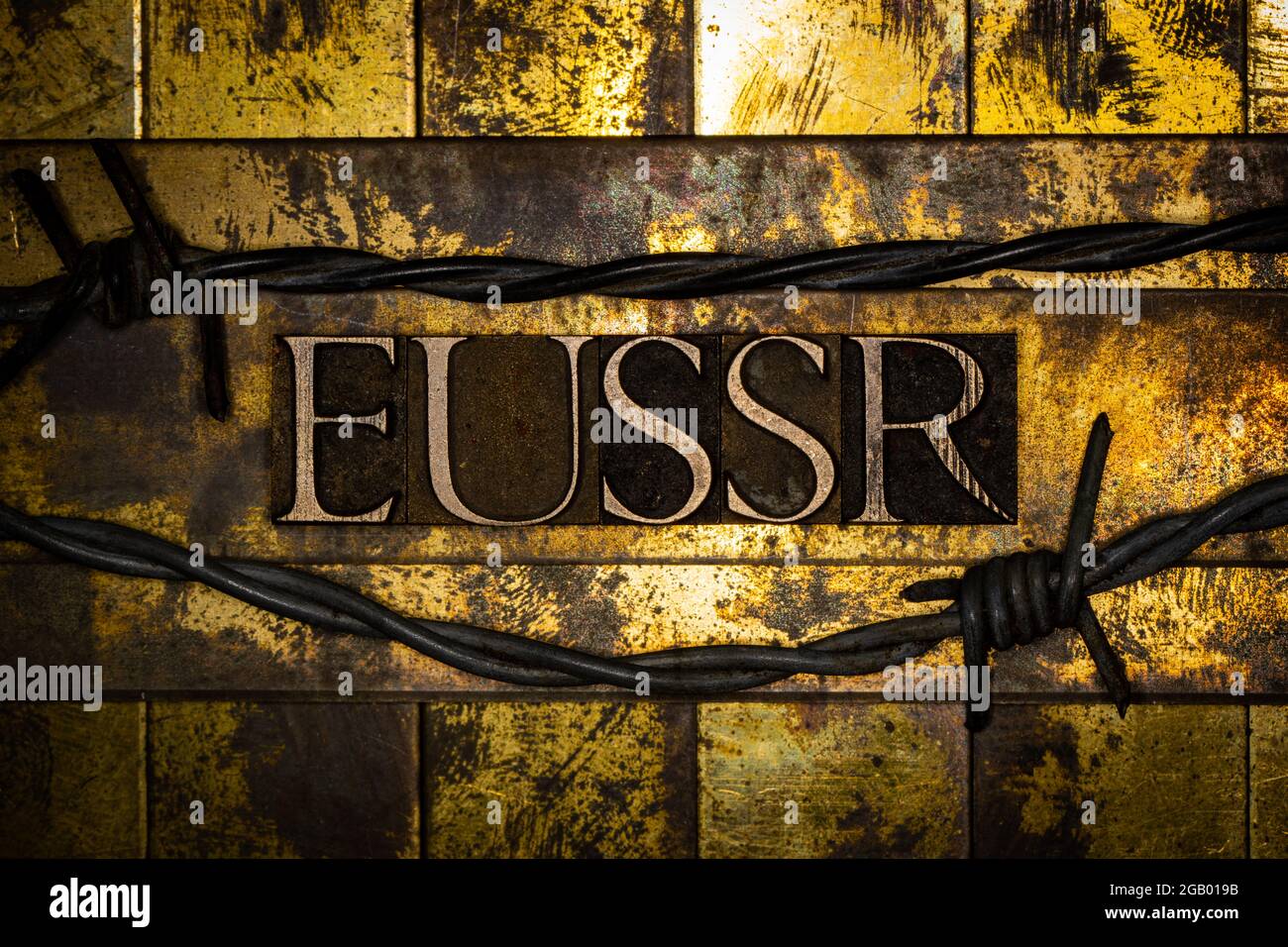 EUSSR text between barbed wire on vintage textured grunge gold and ...