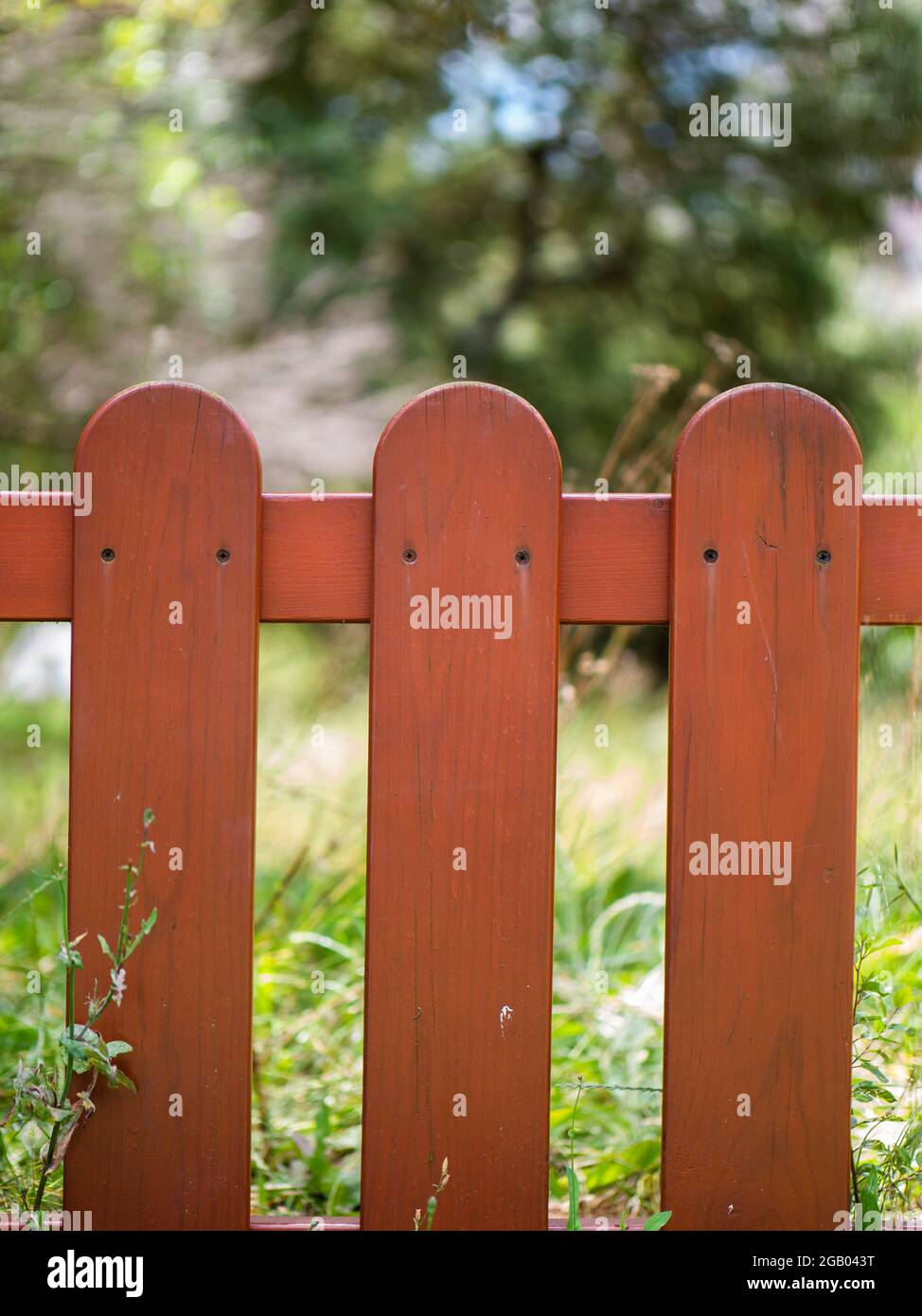 Brown wooden picket fence Stock Photo - Alamy