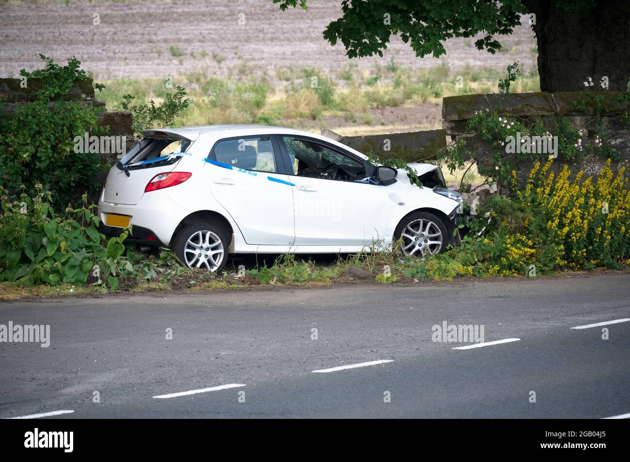 Car crash in rural countryside and damaged wall Stock Photo - Alamy