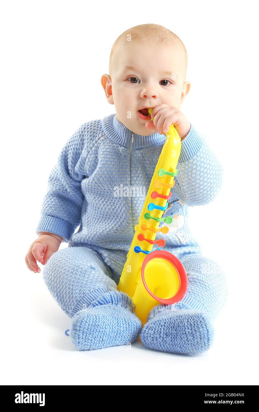 Adorable baby with plastic colourful saxophone isolated on white ...