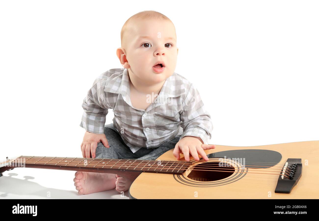 Cute baby with guitar isolated on white background Stock Photo - Alamy