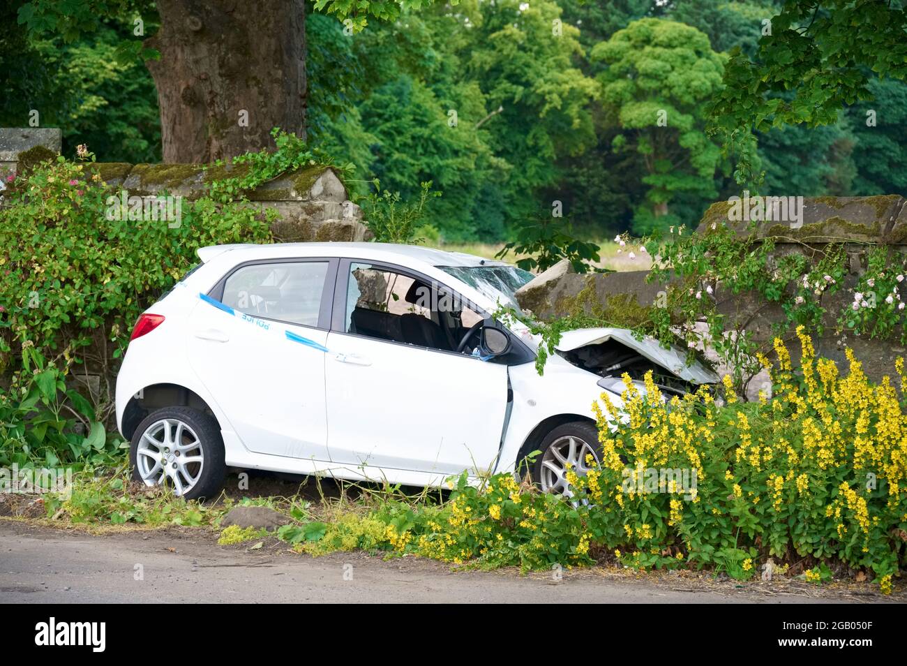 Car crash in rural countryside and damaged wall Stock Photo - Alamy