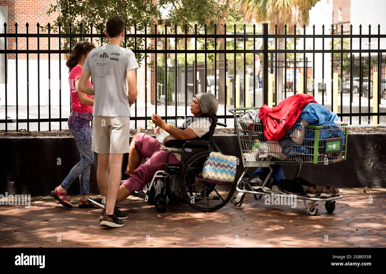 Tampa, Florida, USA. 1st Aug, 2021. A couple visits with a homeless ...