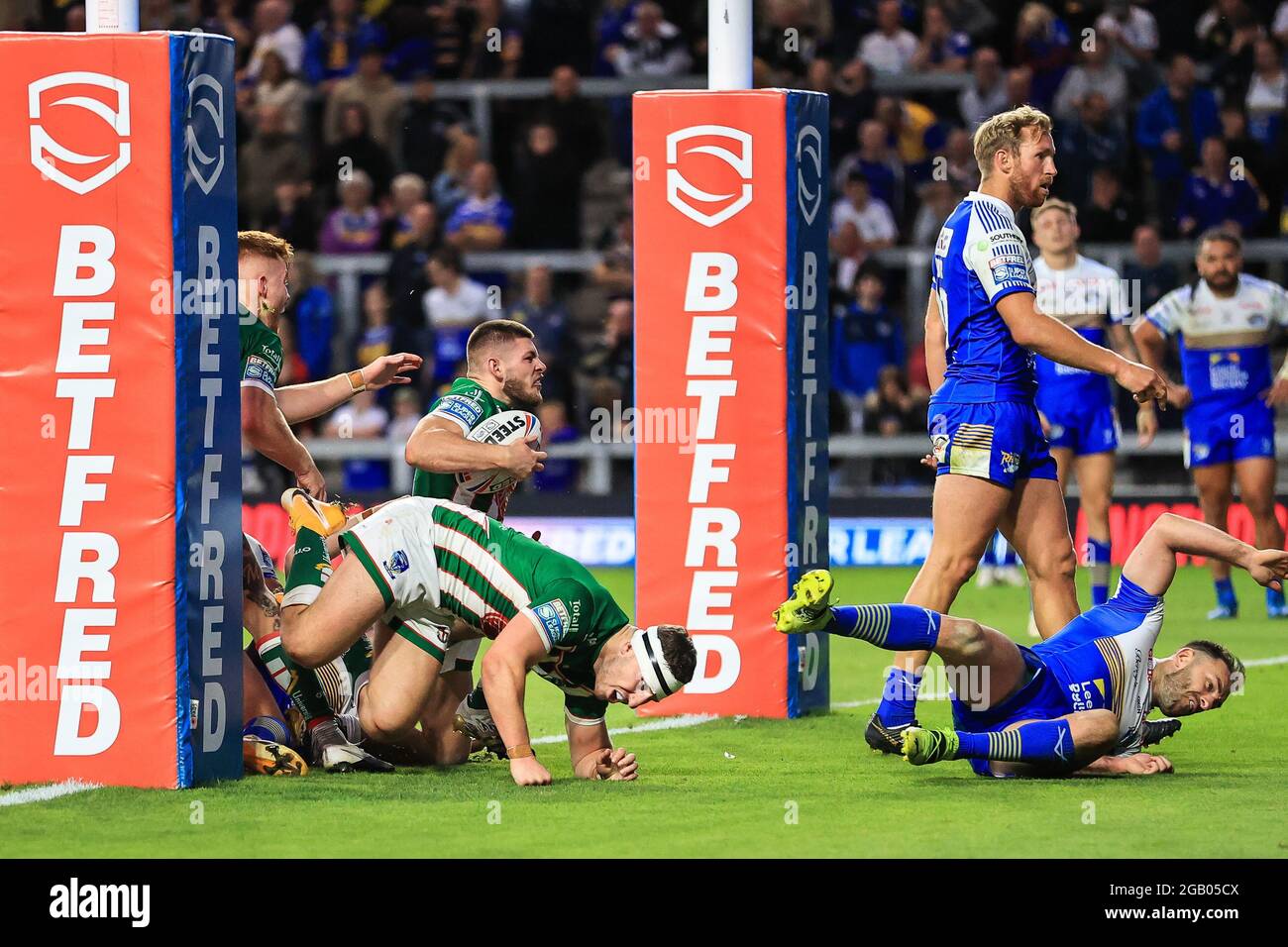 Danny Walker (16) of Warrington Wolves celebrates his try in, on 8/1 ...
