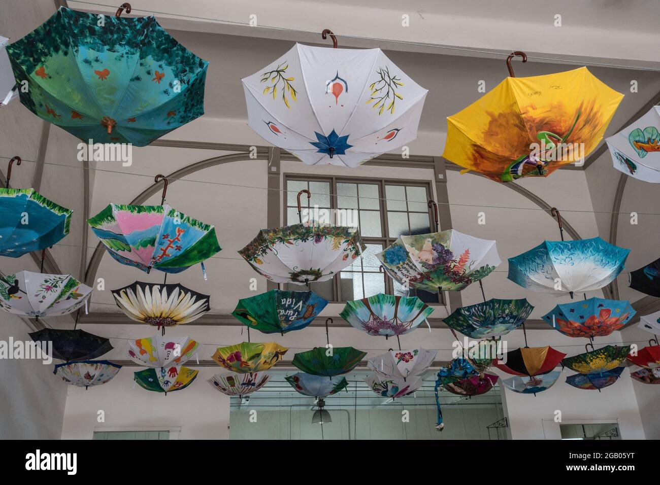 Colorful umbrellas hanging from the ceiling of the Central Post Office ...