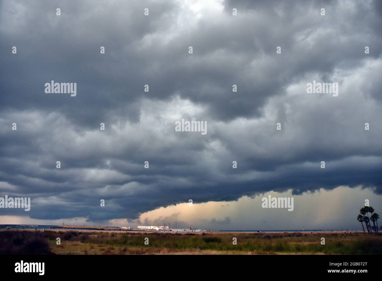 Large clouds float over the maritime neighbourhood of Coma-ruga before ...