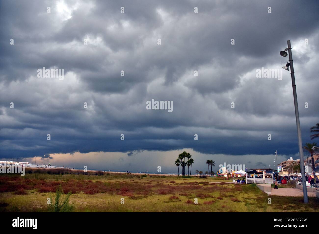 Large clouds float over the maritime neighbourhood of Coma-ruga before ...