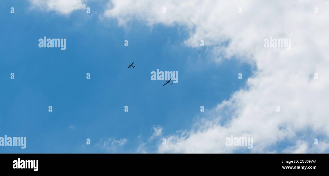 Glider planes flying in the sky. Extreme active sport. Cloudy blue sky ...