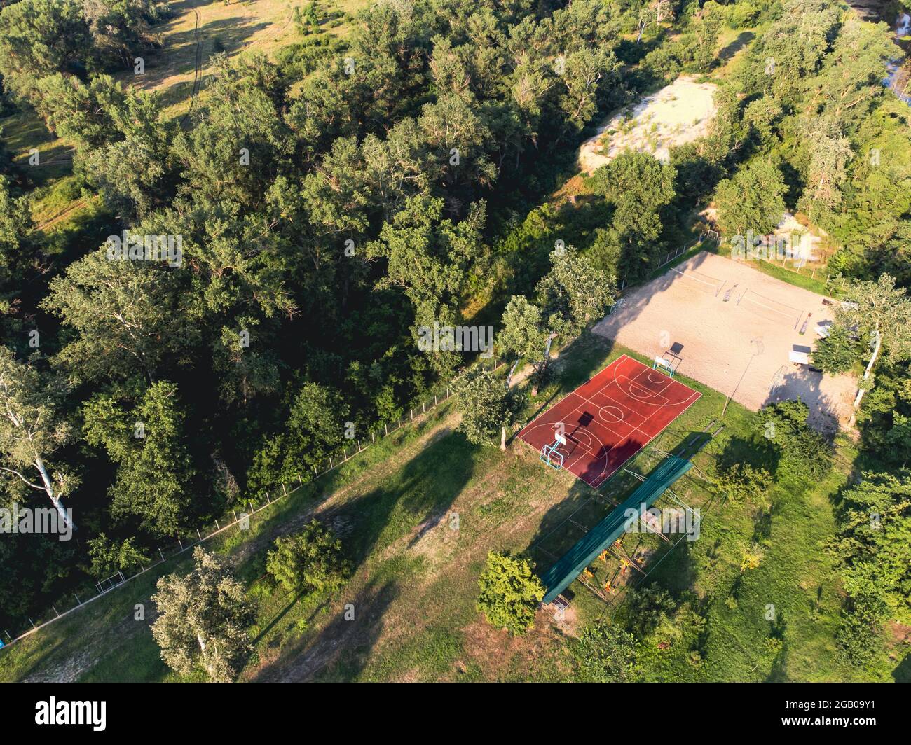 Aerial View of basketball court in a nature environment. Sunset summer ...