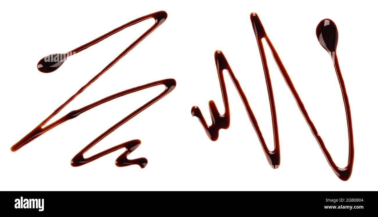 Chocolate syrup drizzle isolated on white background. Splashes of sweet ...